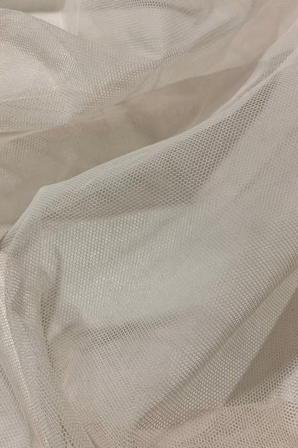 Swiss Cotton Bobbinet in Ivory fabric is often used for bridalwear ...