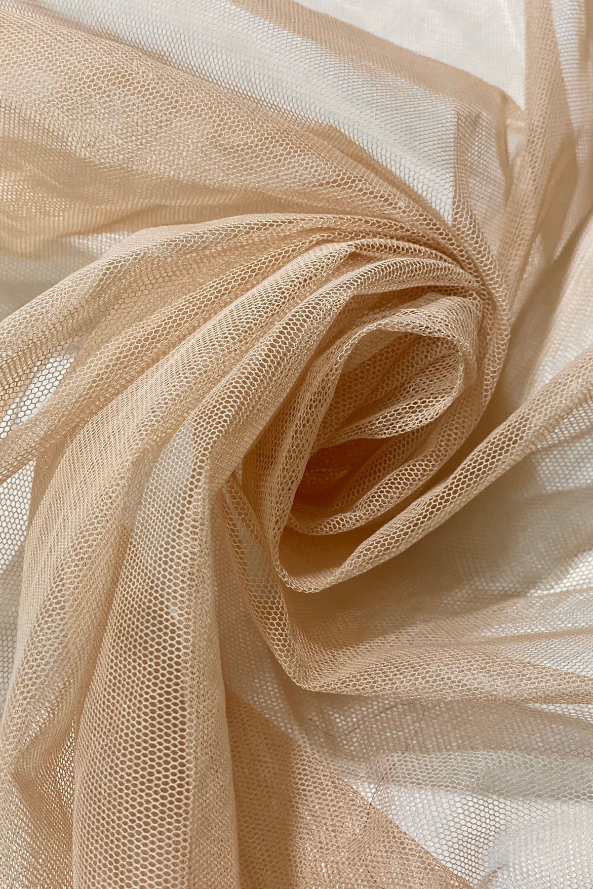 Swiss Cotton Bobbinet in Nude fabric is often used for bridalwear ...