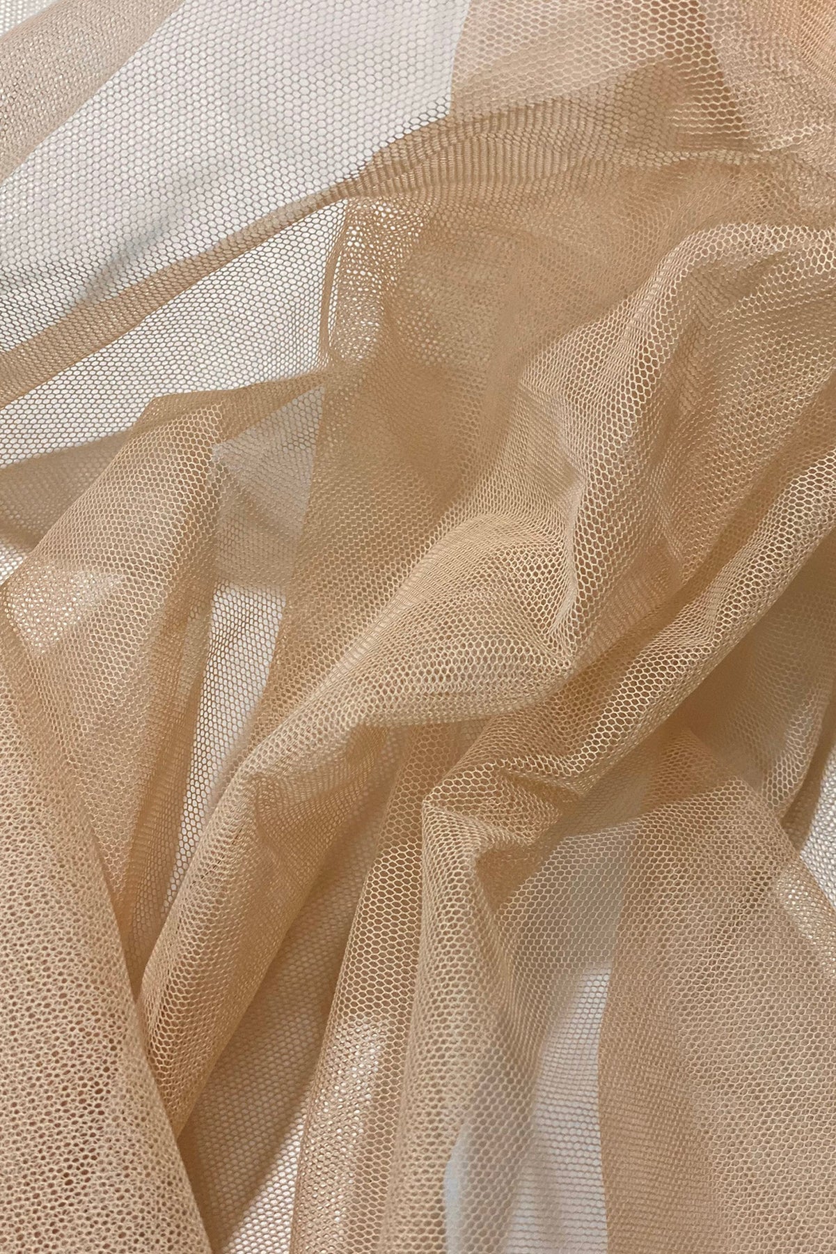 Swiss Cotton Bobbinet in Nude fabric is often used for bridalwear ...